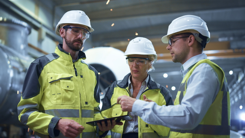 Three Heavy Industry Engineers Stand Stock Footage Video (100% Royalty ...
