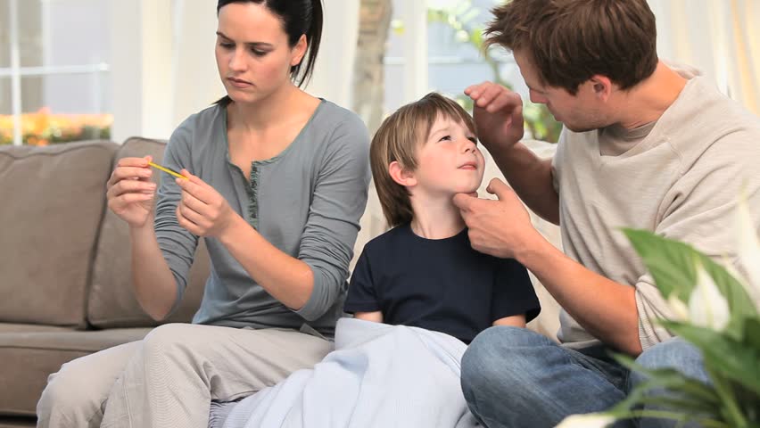 parents checking their son's fever Stock Footage Video (100% Royalty ...