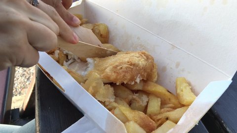 Young Woman Eating Fish Chips Outside Stock Footage Video (100% Royalty ...