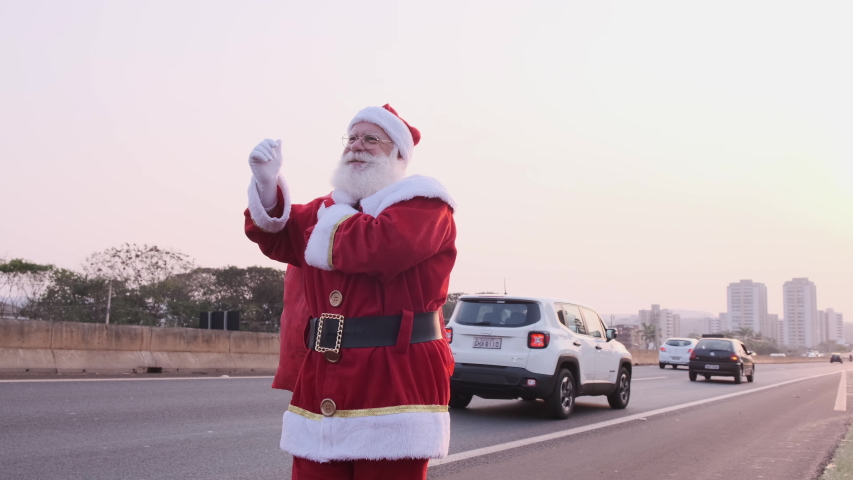 santa claus on side highway hitchhiking Stock Footage Video (100% ...