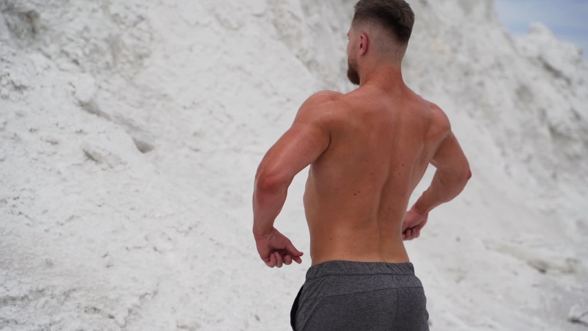 Bodybuilder posing in studio. Handsome shirtless athletic man Videos of ...