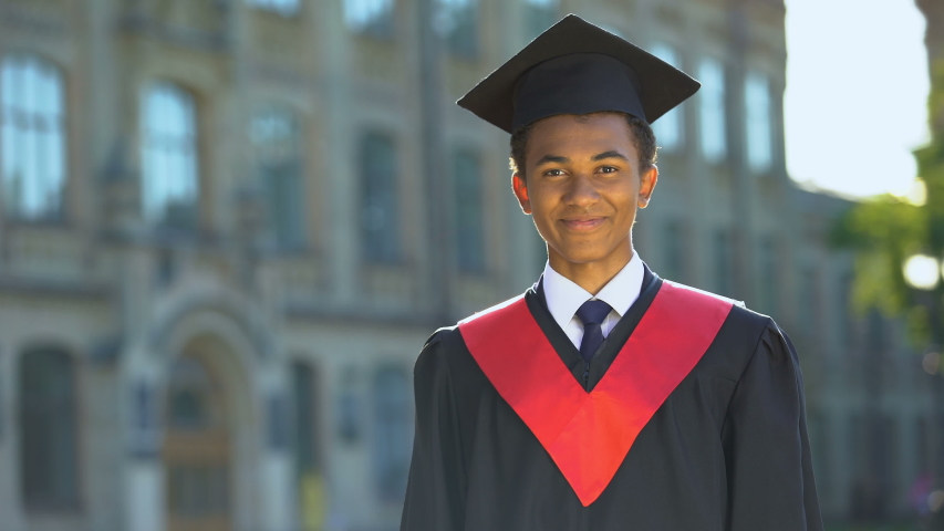 satisfied black male graduation gown smiling Stock Footage Video (100% ...
