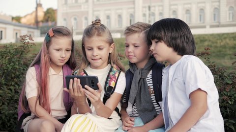 Young Children Using Mobile Phone Stock Footage Video (100% Royalty ...