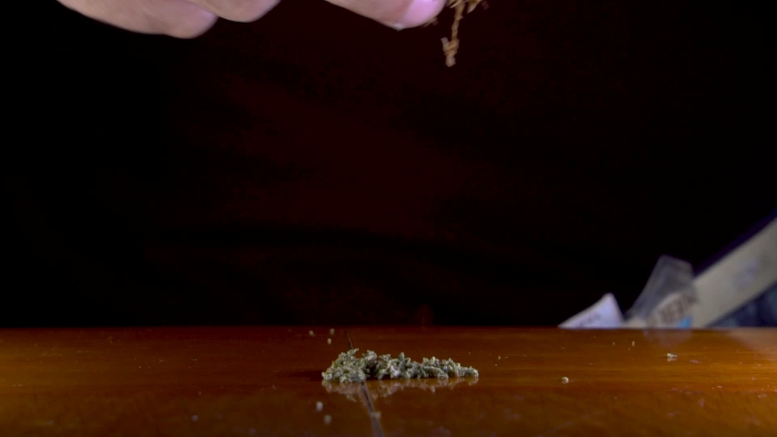 male hands mixed normal tobacco weed Stock Footage Video (100% Royalty ...