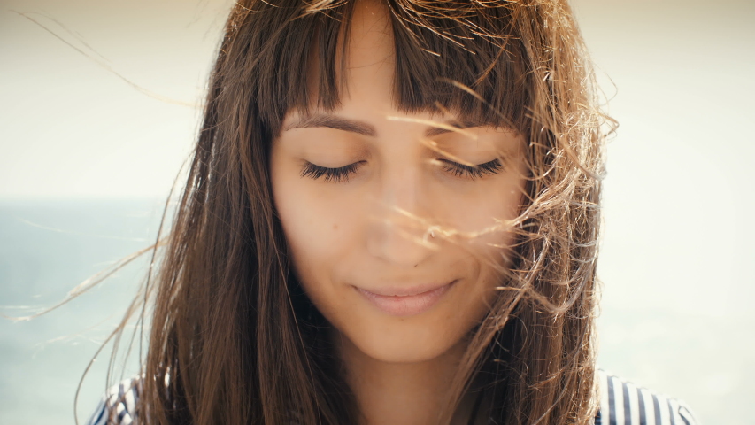 wind blowing through woman's hair Stock Footage Video (100% Royalty ...