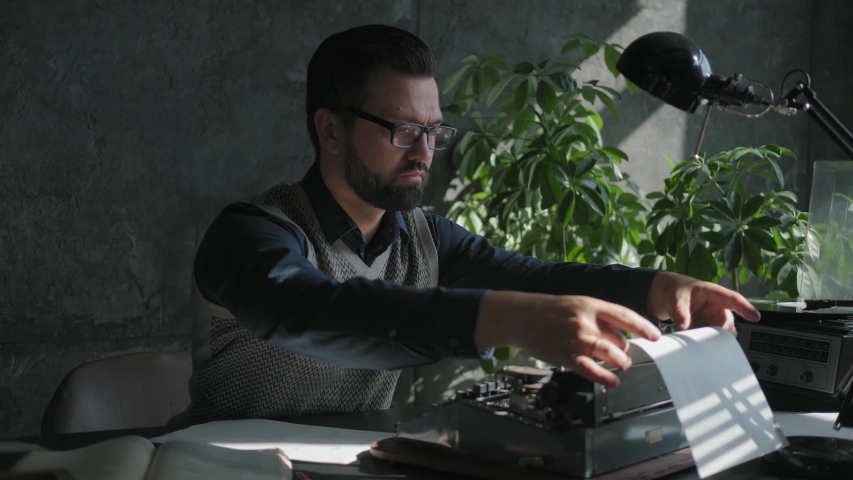 In the office working man concentrated typing some notes on the ...