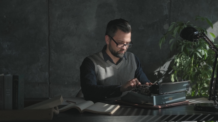 In the office working man concentrated typing some notes on the ...