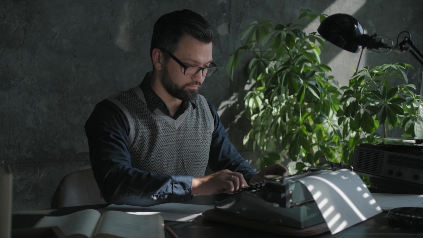 In the office working man concentrated typing some notes on the ...