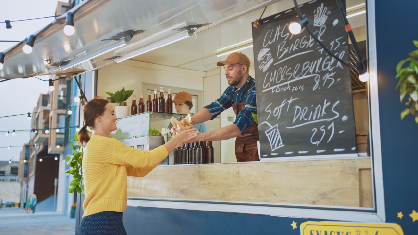 food truck employee hands out freshly Stock Footage Video (100% Royalty ...