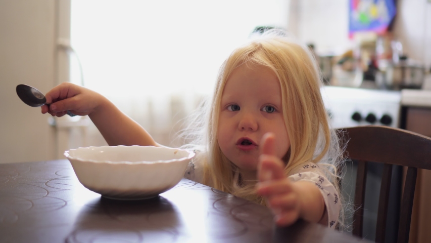 Little Blond Girl Child Eats Stock Footage Video (100% Royalty-free ...