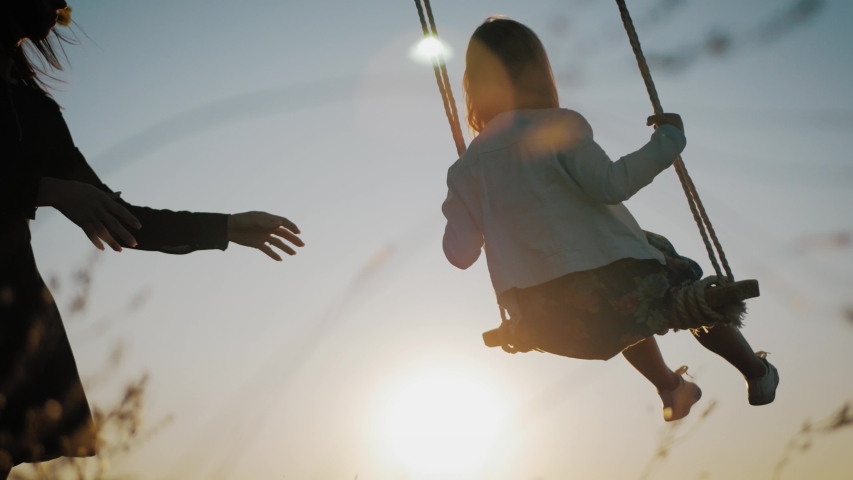 Young Mother Her Child Daughter Swinging Stock Footage Video (100% Royalty-free) 1038588368 ...