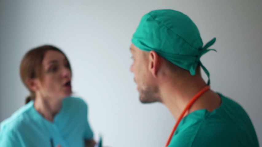 two doctors arguing hallway clinic emotional Stock Footage Video (100% ...