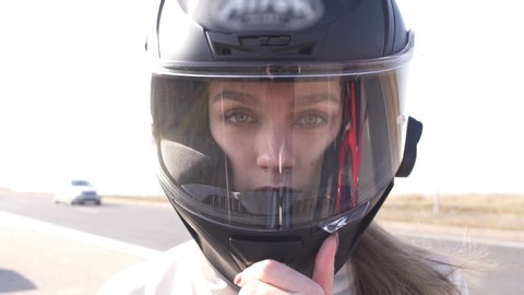 woman rider taking off motorcycle helmet Stock Footage Video (100% ...