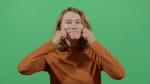 Woman Pinching Both Cheeks Studio Isolated Stock Footage Video (100% ...