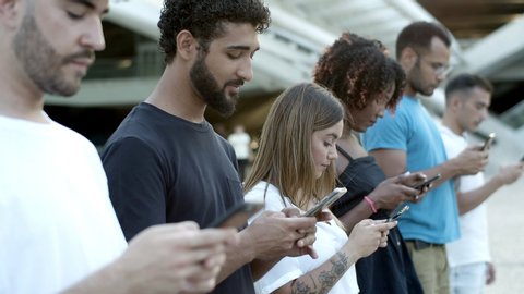 Young People Using Mobile Phone Public Stock Footage Video (100% ...