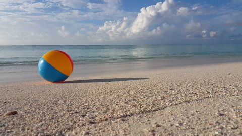 Colorful Beach Ball Rolling Into Sea Stock Footage Video (100% Royalty ...