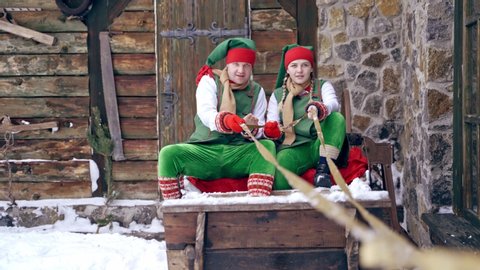 Two Elves Green Costumes Sitting Wooden Stock Footage Video (100% ...