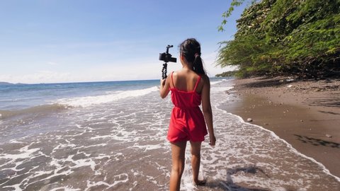 Back View Female Vlogger Walking Recording Stock Footage Video (100% ...