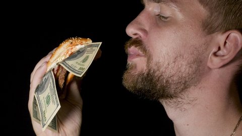 Man eating money Stock Video Footage - 4K and HD Video Clips | Shutterstock