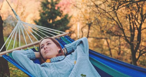 Woman Relaxes Hammock Autumn Slow Motion Stock Footage Video (100% ...