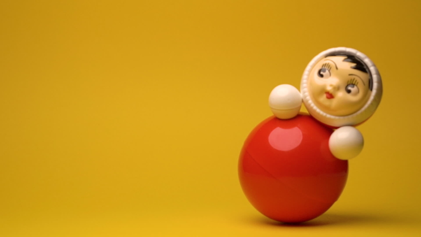 Roly Poly Children Toy On Yellow Stock Footage Video (100% Royalty-free ...