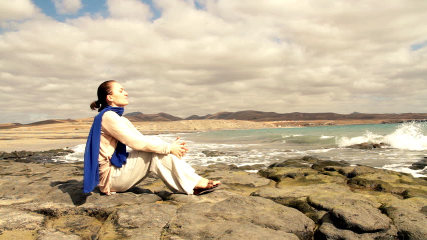 young woman sitting on stones thoughtfully Stock Footage Video (100% ...