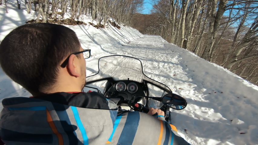 person-riding-snowmobile-with-mountains-in-the-background image - Free ...