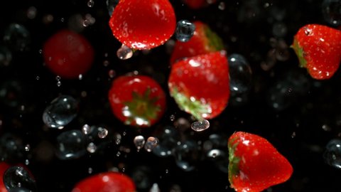 exploding cherry tomatoes water on black Stock Footage Video (100% ...