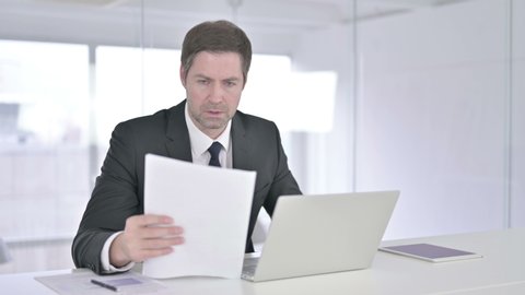 Businessman Comparing Two Documents Neutral Background Stock Photo ...