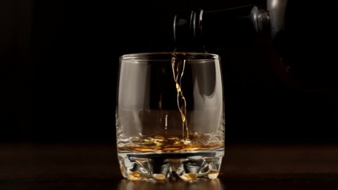 Running Brandy Glass Bottle Flowing Brown Stock Footage Video (100% ...