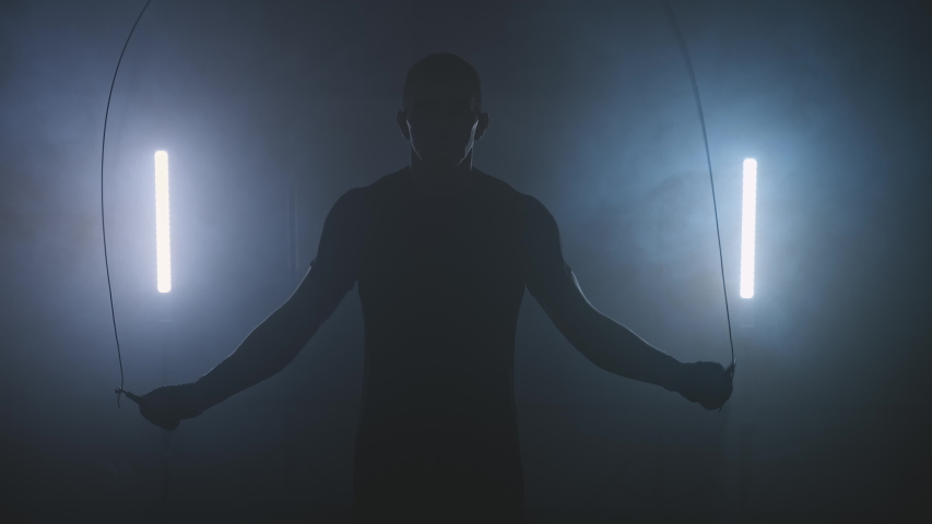 fighter doing jump rope exercises dark Stock Footage Video (100% ...