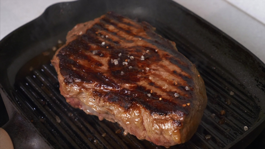 chef sprinkled salt on grilled beef Stock Footage Video (100% Royalty ...