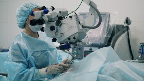 Surgeon Observing Eye Operation Through Medical Stock Footage Video ...