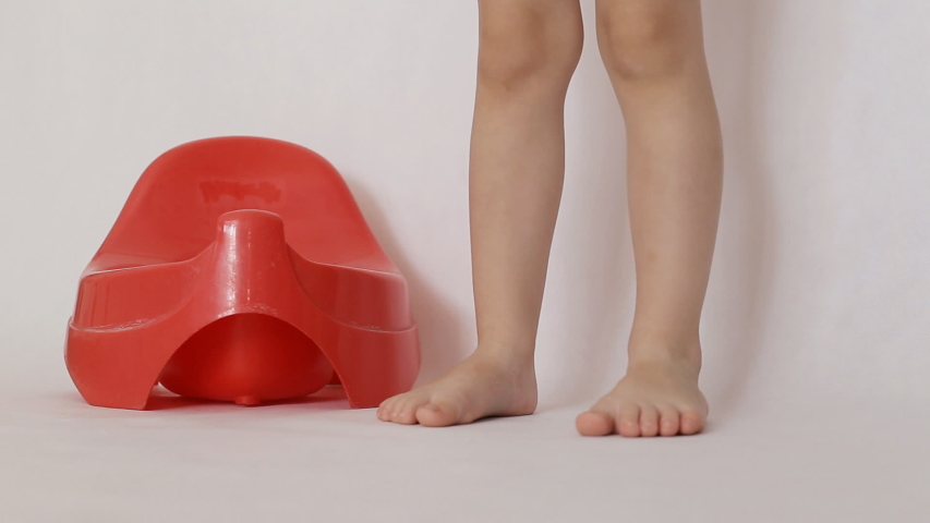 little girl sits on red pot Stock Footage Video (100% Royalty-free ...