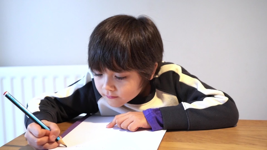 portrait adorable kid sitting alone doing Stock Footage Video (100% ...