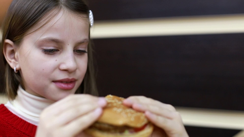 Happy Hungry Girl Eating a Stock Footage Video (100% Royalty-free ...