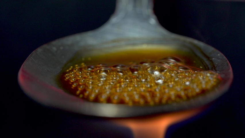 lighters flame boiling liquid spoon dimly Stock Footage Video (100% ...