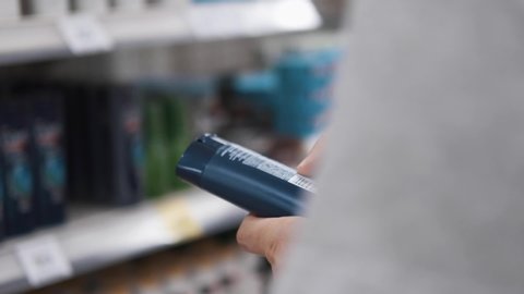 Male Customer Reading Label On Cosmetic Stock Footage Video (100% ...