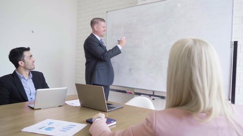Male Manager Writing Something On Whiteboard Stock Footage Video (100% ...