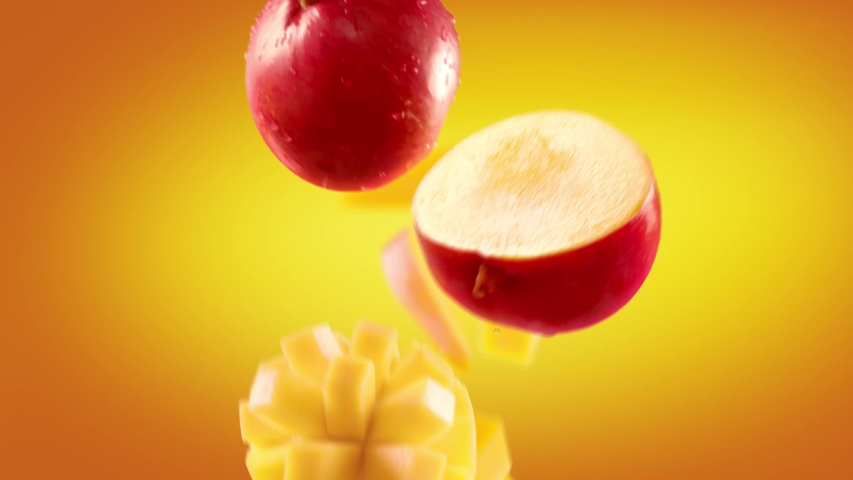flying mango slices orange background Stock Footage Video (100% Royalty ...
