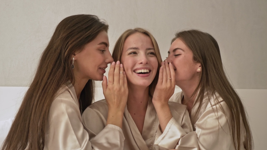attractive surprised young girls talking secrets Stock Footage Video ...