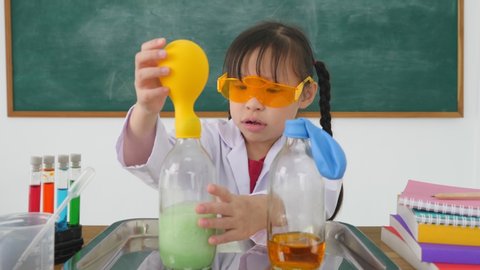 Little Asian Girl Doing Science Experiment Stock Footage Video (100% ...