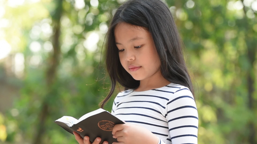 Little Girl Hold Bible Stock Video Footage - 4K and HD Video Clips ...