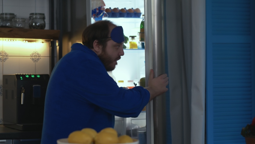 funny overweight guy sneaking kitchen midnight Stock Footage Video (100 ...