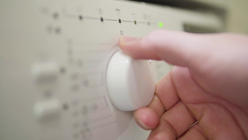 person pushes buttons on washing machine Stock Footage Video (100% ...