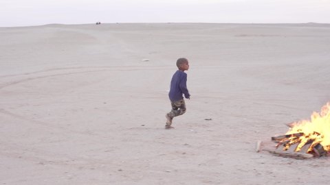 African Boy Making Fire Sahara Desert Stock Footage Video (100% Royalty ...