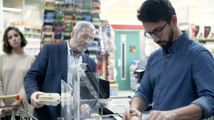 Mature Man Cash Register Supermarket Young Stock Footage Video (100% ...