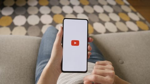 Woman Scrolling Youtube Channels On Smartphone Stock Footage Video (100 ...