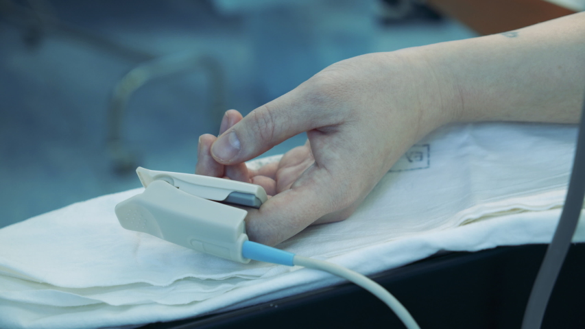 patient's hand medical transmitter attached Stock Footage Video (100% ...