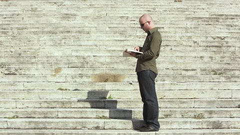 Man Walking Reading Book Stock Footage Video (100% Royalty-free ...
